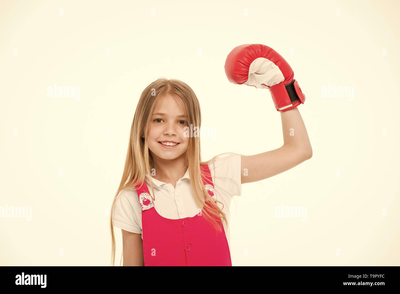 Girl on smiling face posing with boxing glove, isolated on white ...