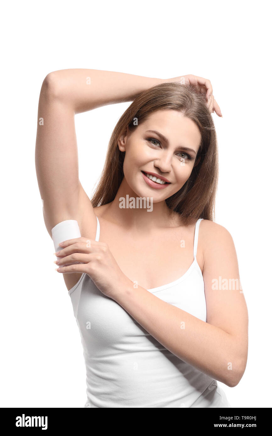 Beautiful young woman with deodorant on white background Stock Photo ...