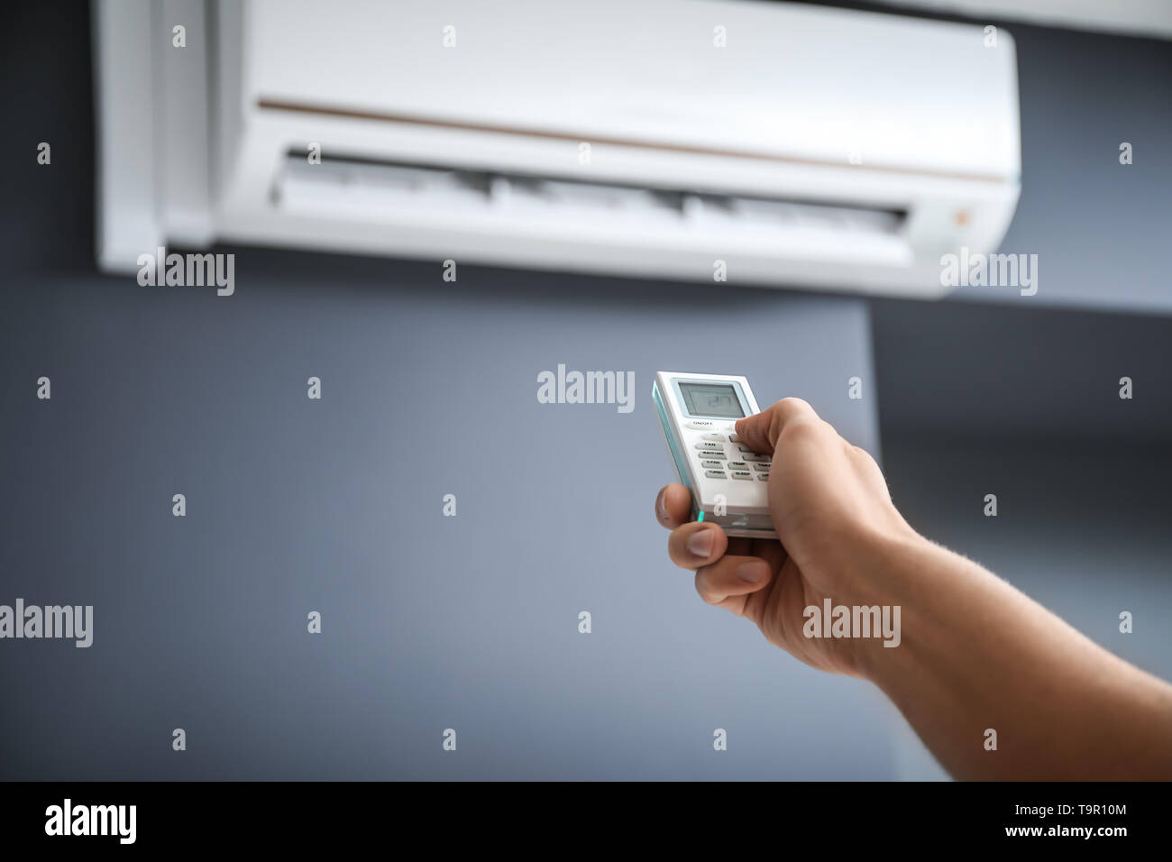 Man control operate air conditioner hi-res stock photography and images ...