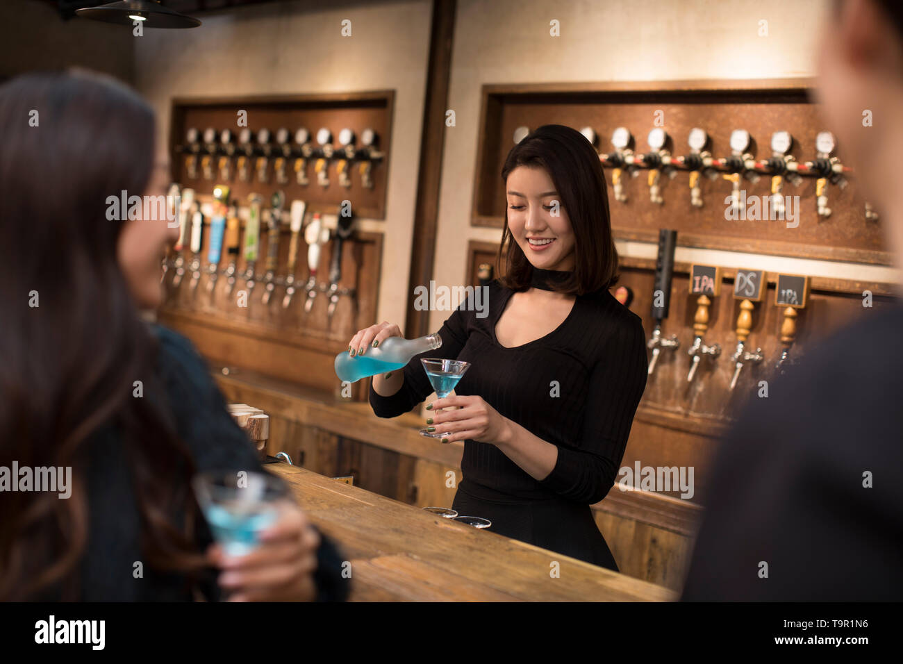Smiling bartender hi-res stock photography and images - Alamy