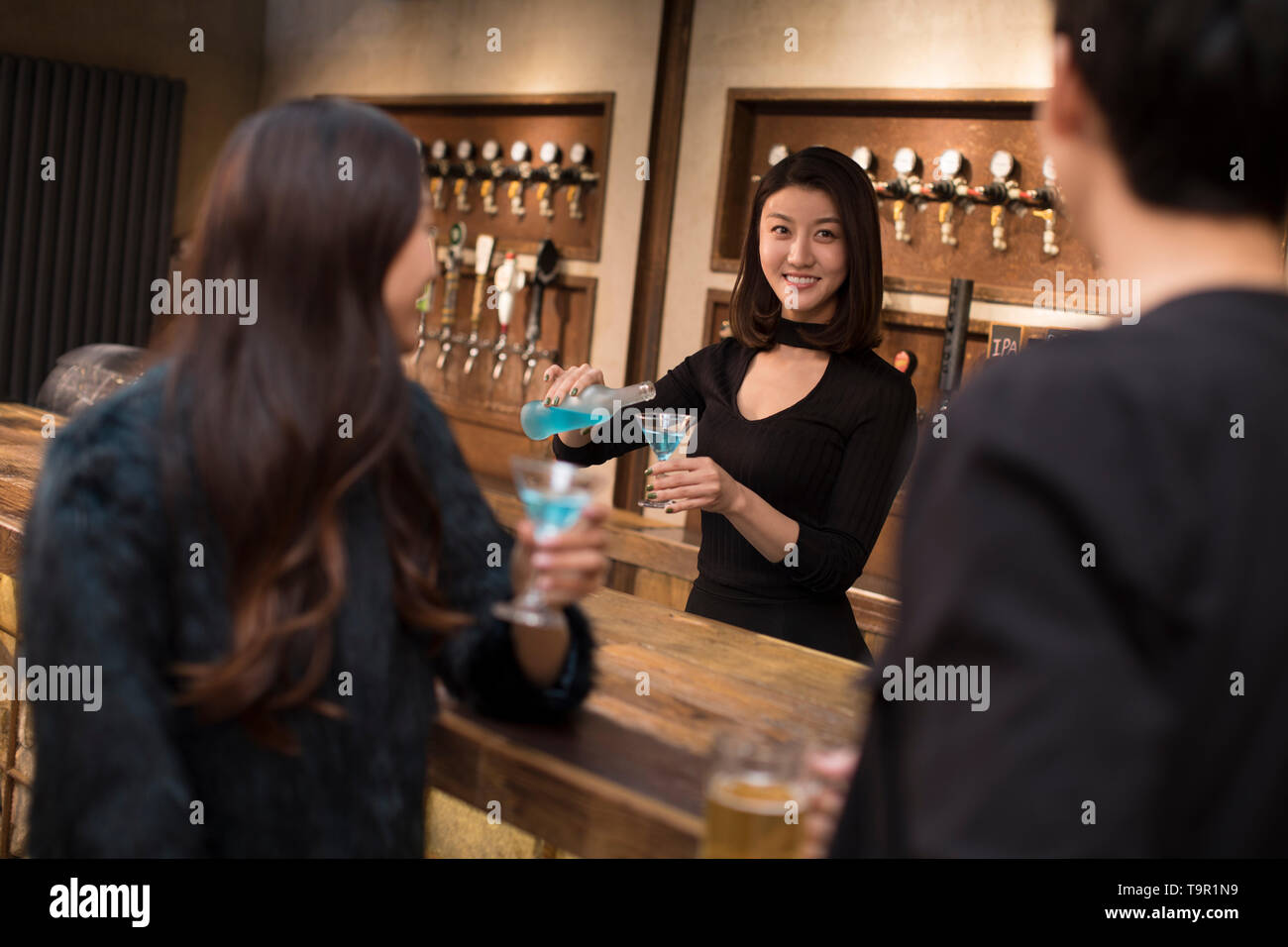 Smiling bartender hi-res stock photography and images - Alamy