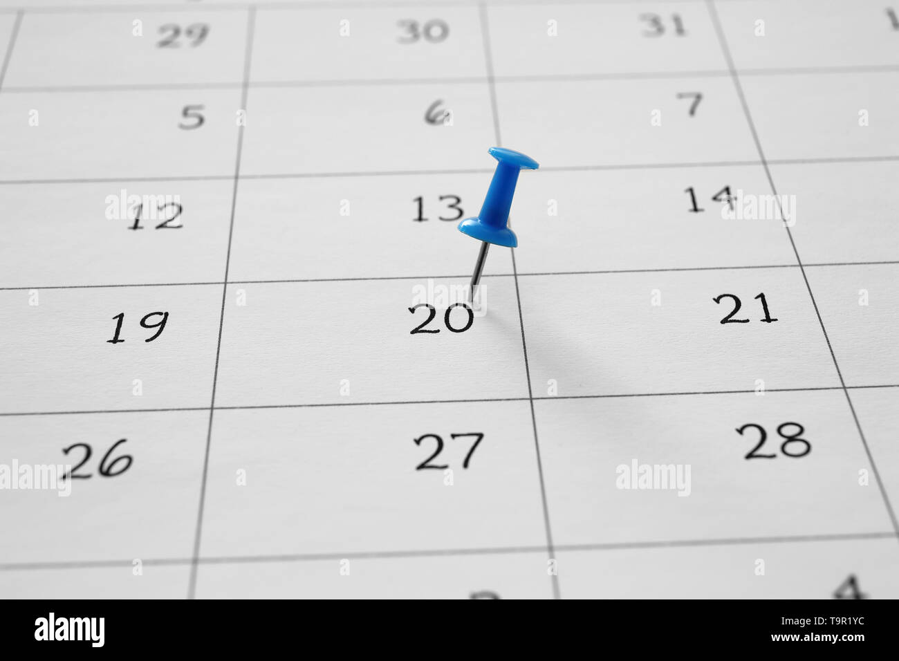 Calendar with pinned date, closeup Stock Photo - Alamy