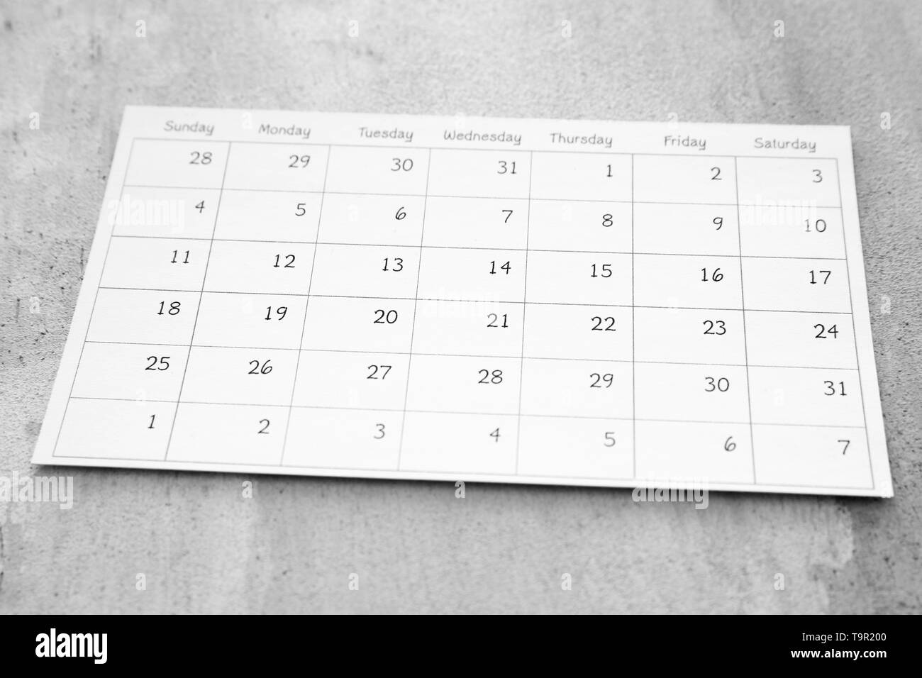Calendar on grey table Stock Photo - Alamy