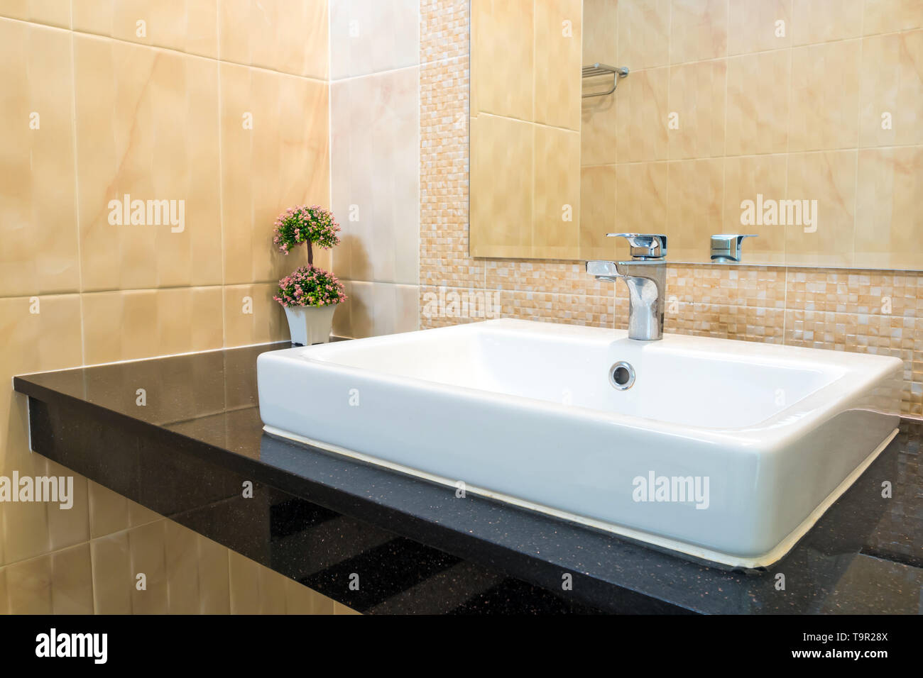 Plastic bouquet in a vase Decorate the wall corner of the wash basin in ...