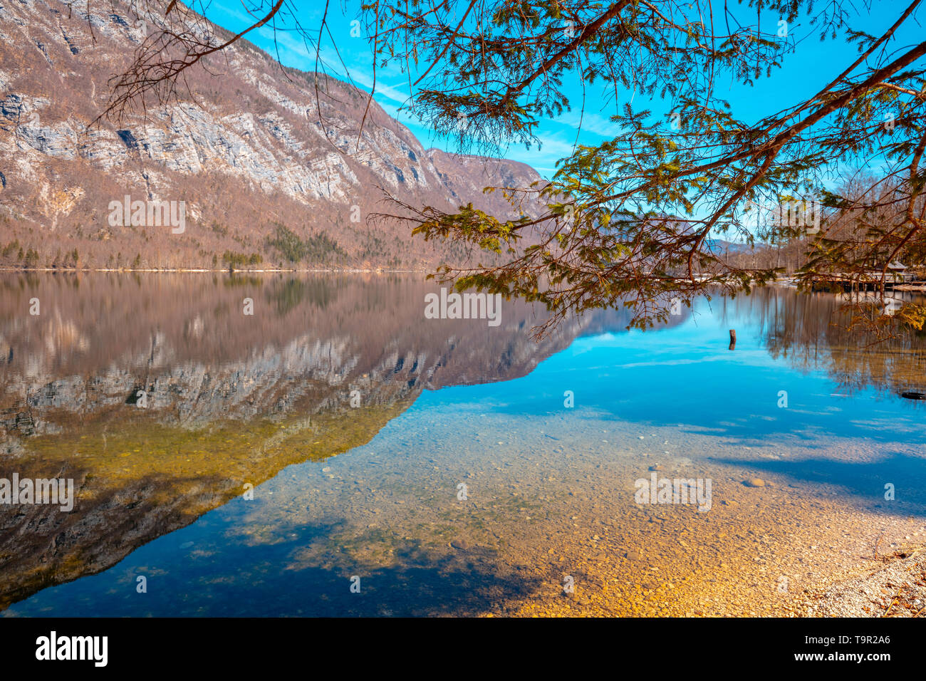 Rocky shore of the mountain lake. Beautiful nature. Reflection on the ...