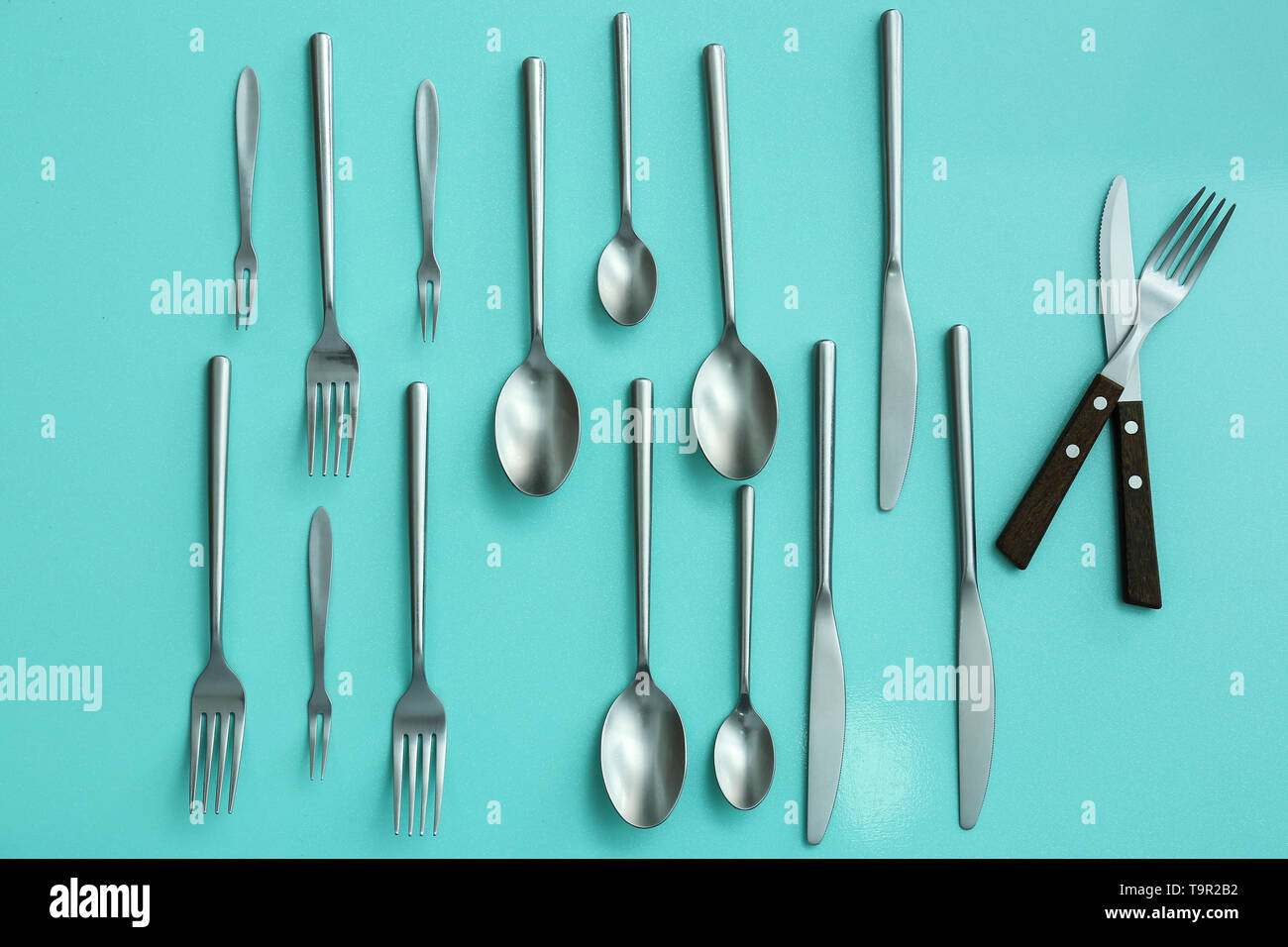 Set of cutlery on color background Stock Photo - Alamy