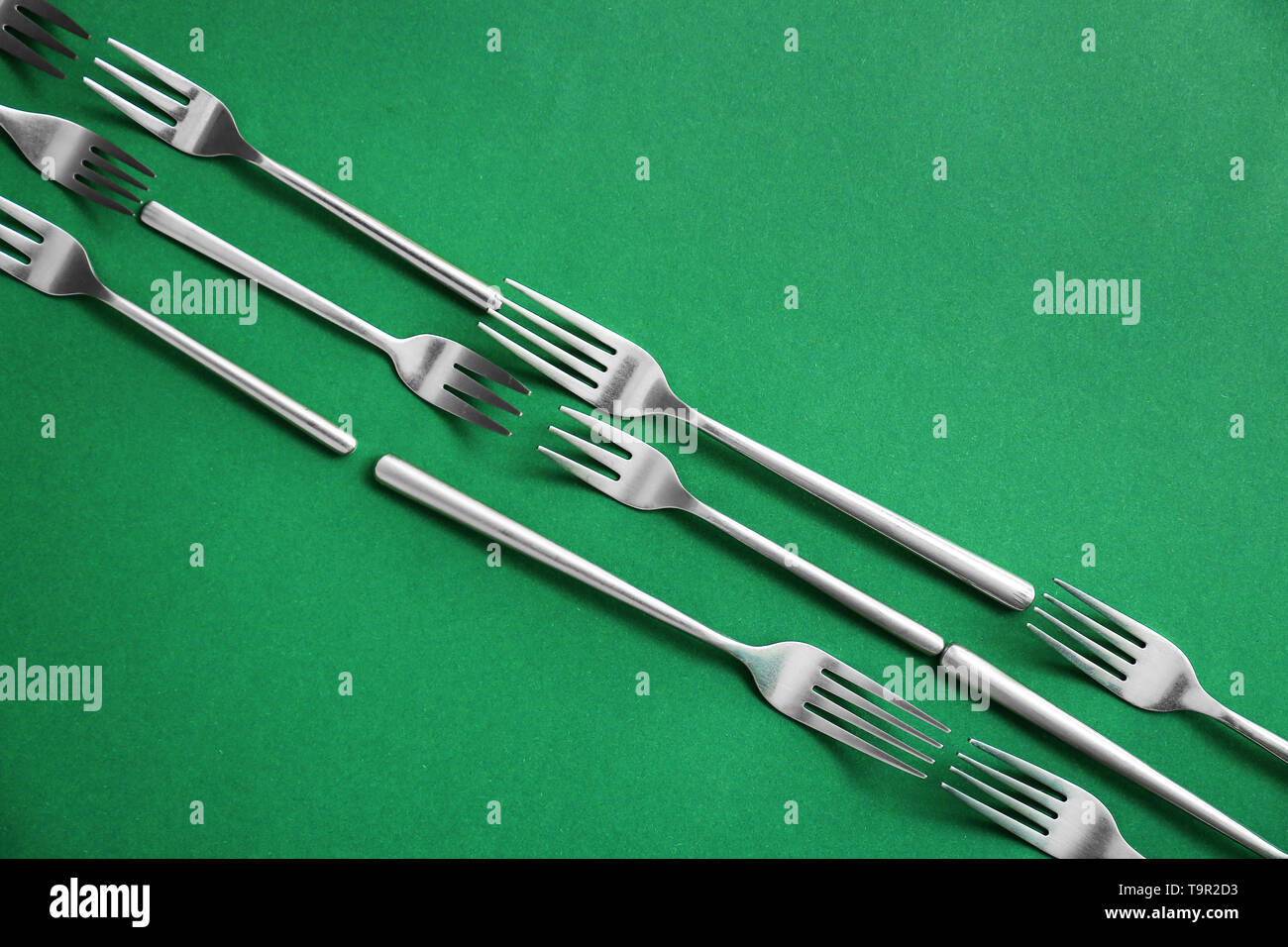 Set of forks on color background Stock Photo - Alamy
