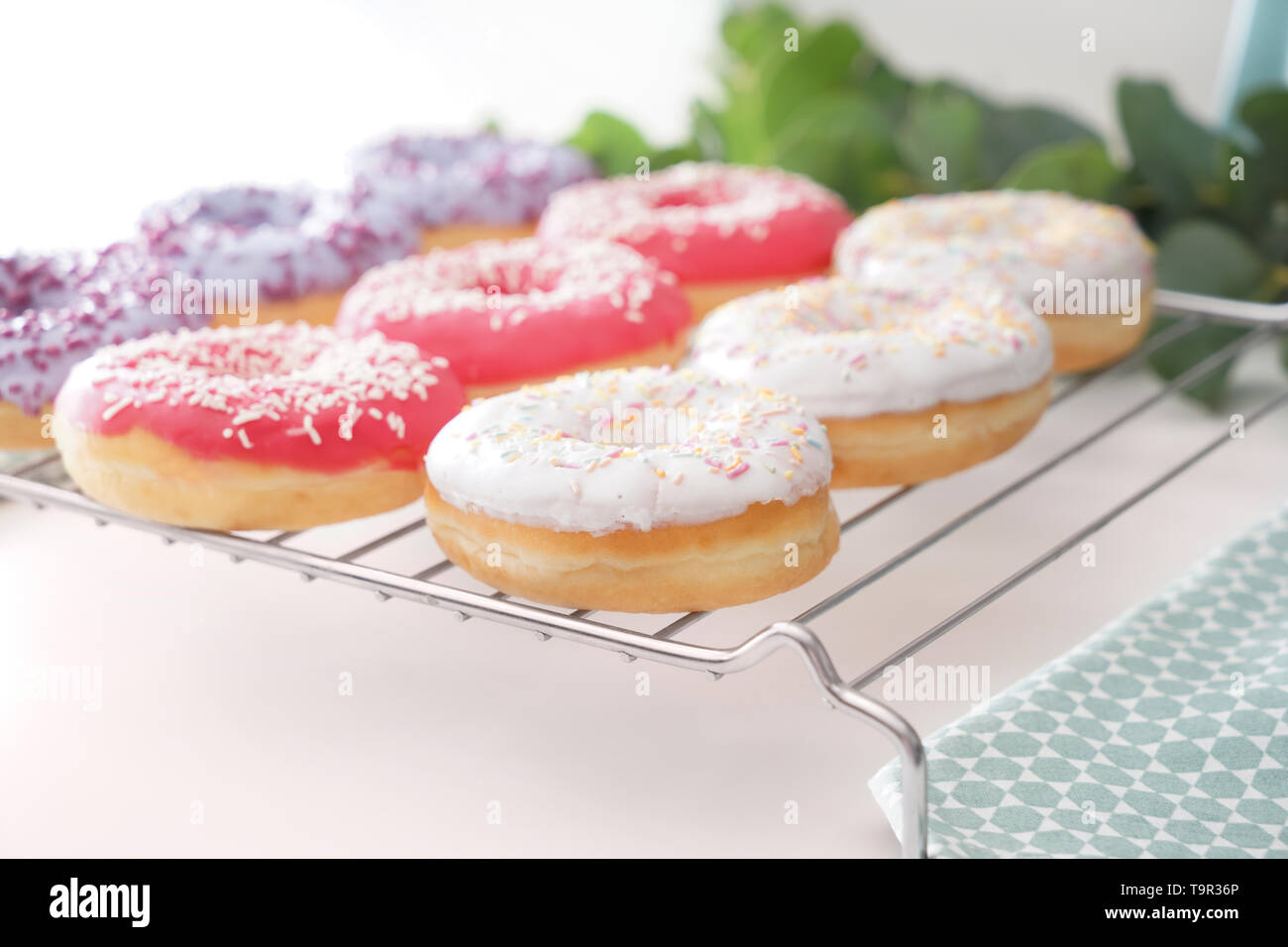 Tasty doughnuts on cooling rack Stock Photo - Alamy