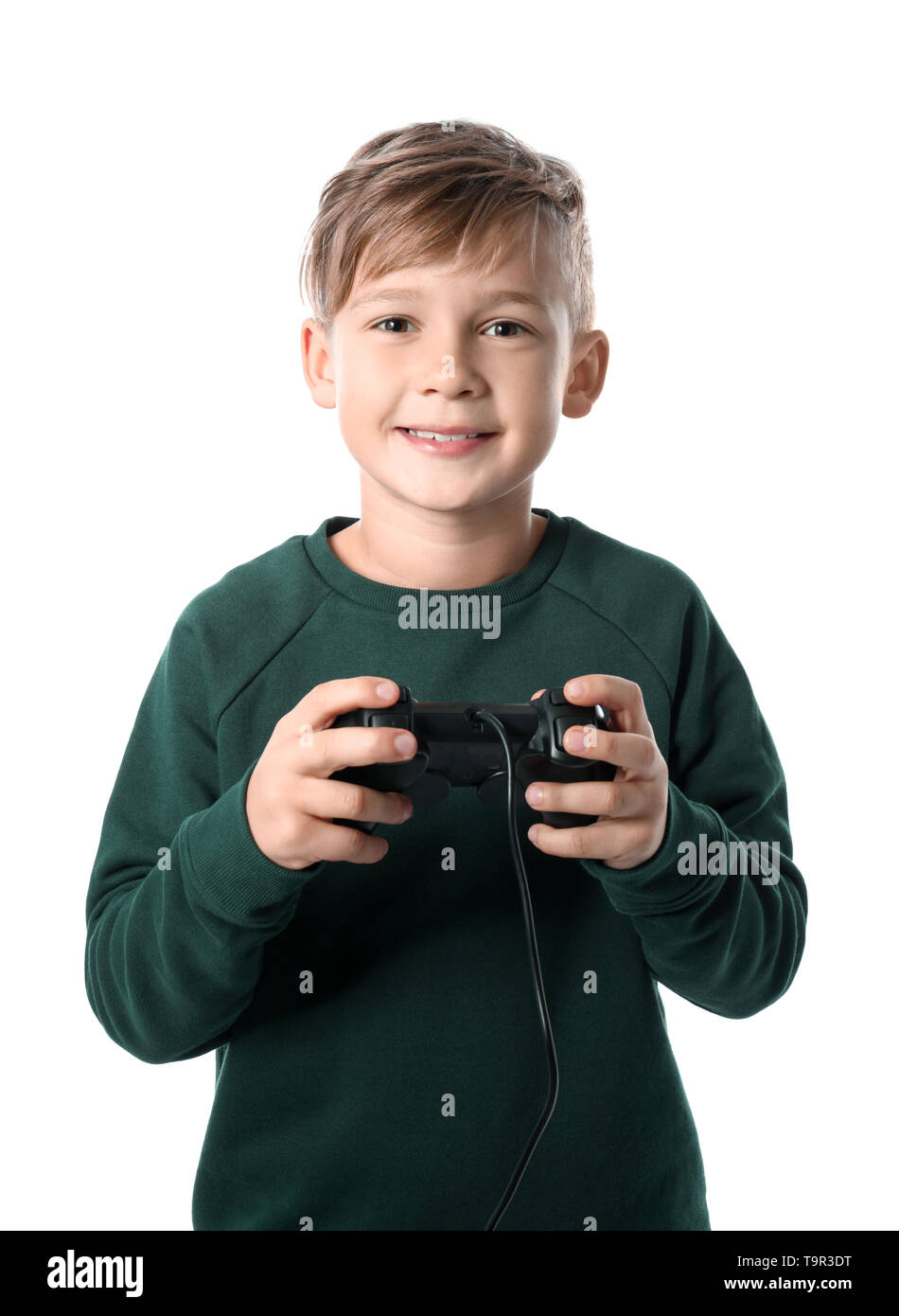 Cute boy playing video game on white background Stock Photo - Alamy