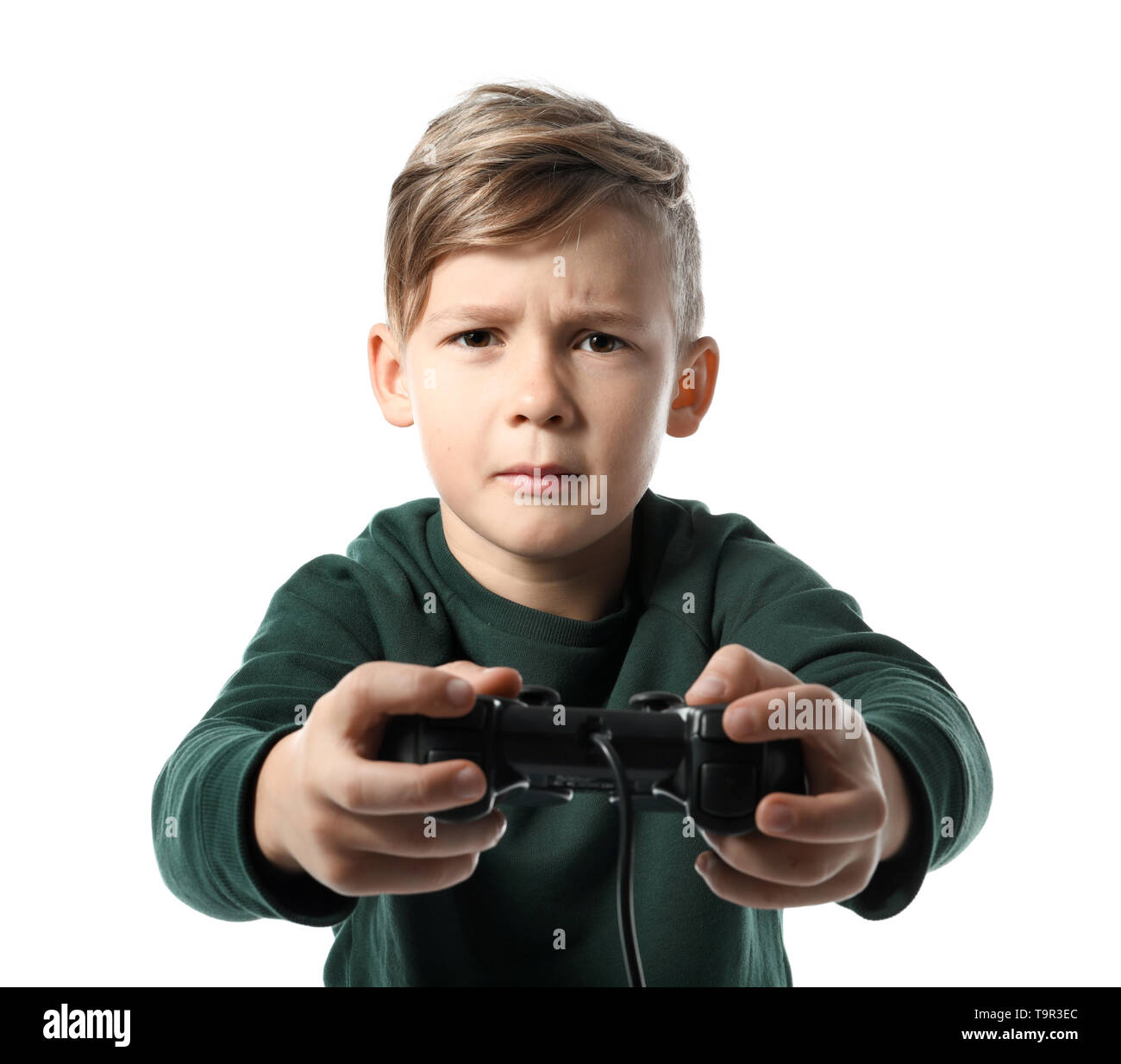 Emotional boy playing video game on white background Stock Photo - Alamy