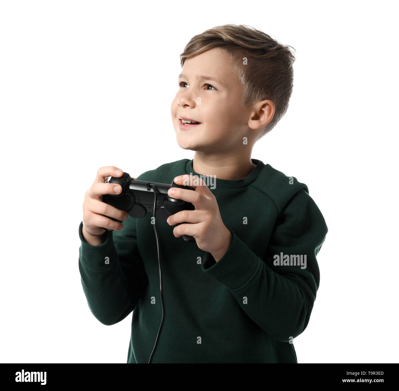 Cute boy playing video game on white background Stock Photo - Alamy