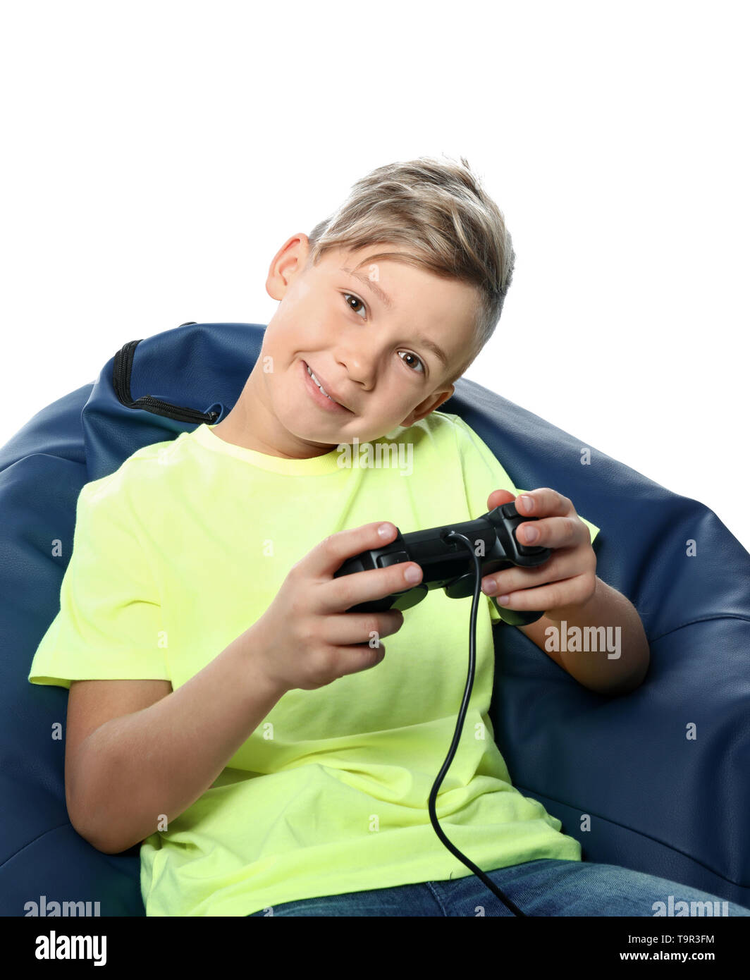 Cute boy playing video game on white background Stock Photo - Alamy