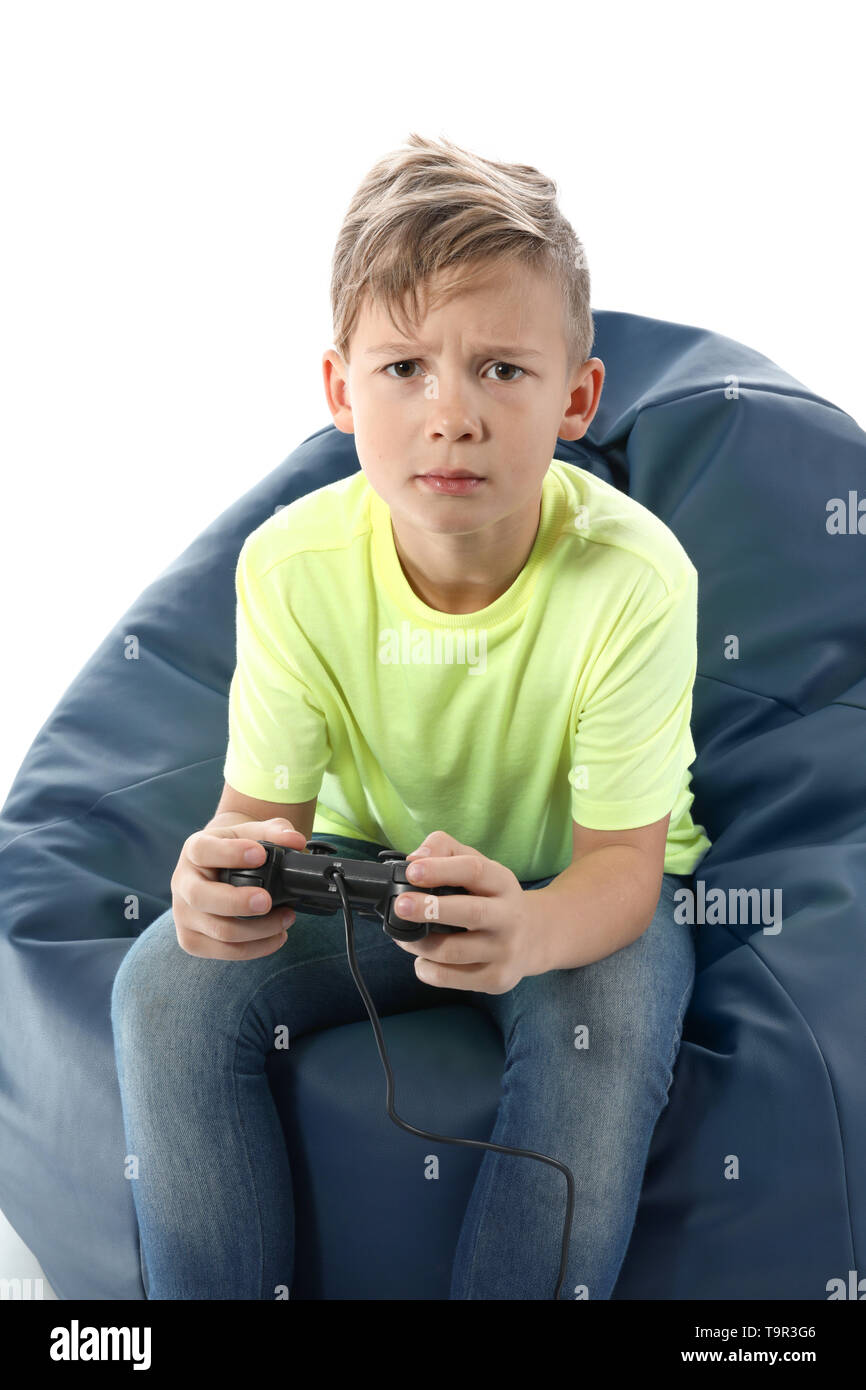 Emotional boy playing video game on white background Stock Photo - Alamy