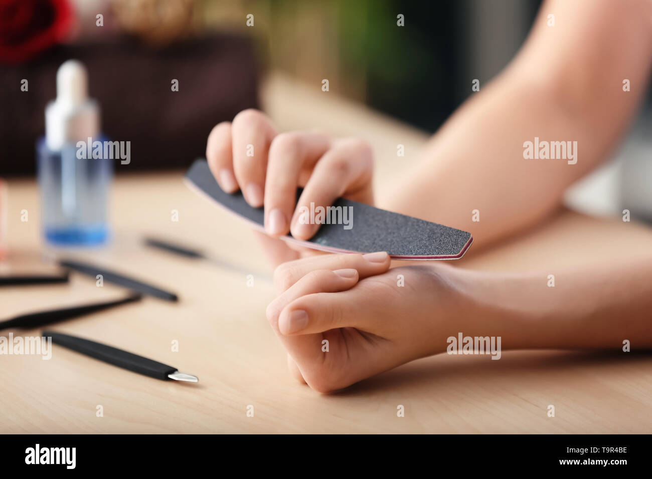 Girl doing nails hi-res stock photography and images - Alamy