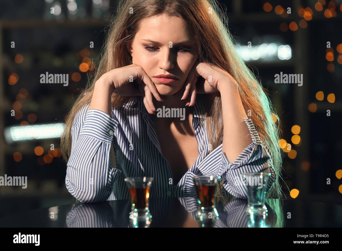 Woman drinking alcohol at bar hi-res stock photography and images - Alamy
