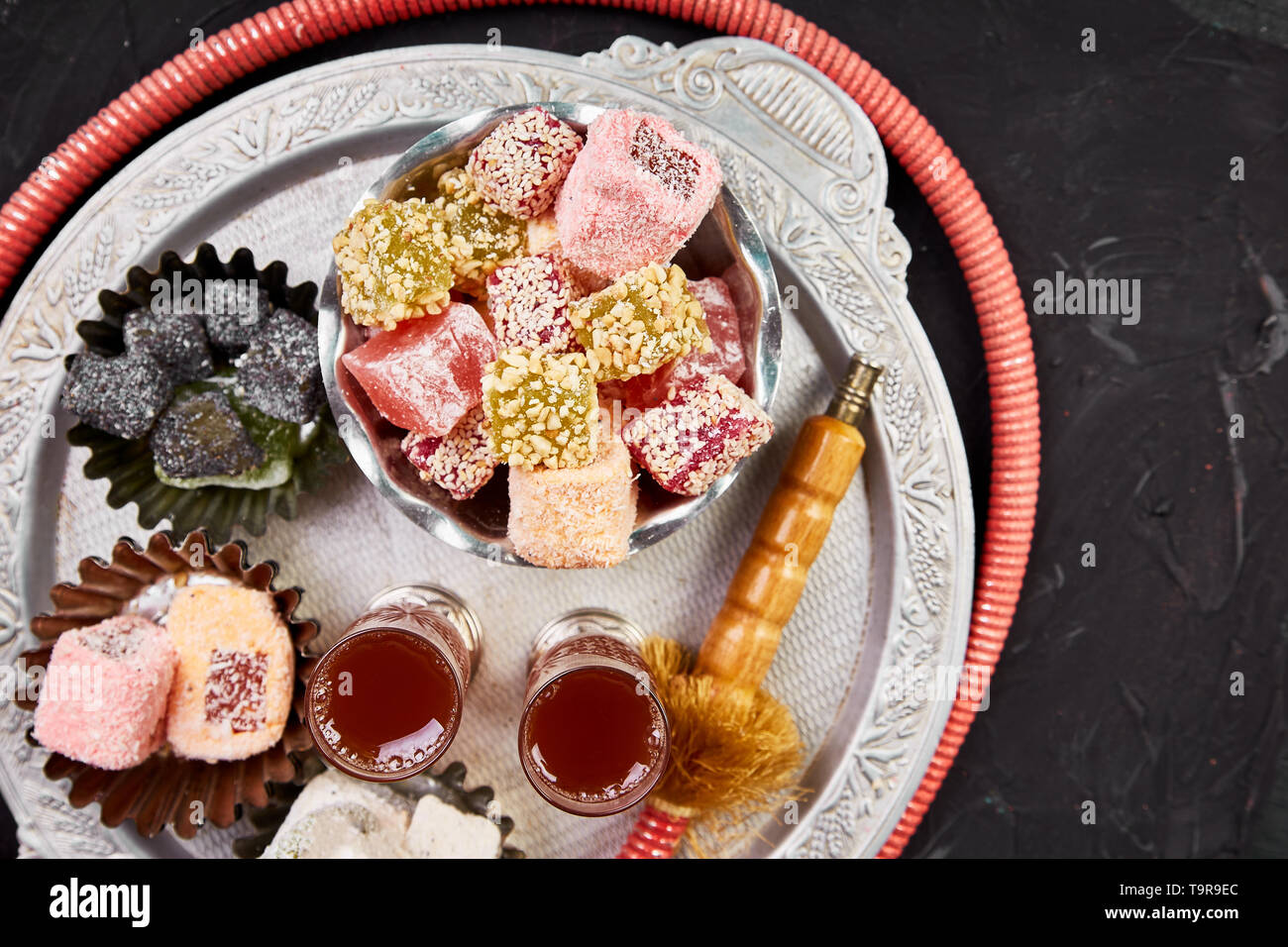 Set of various Turkish delight in traditional silver bowl on metal tray ...