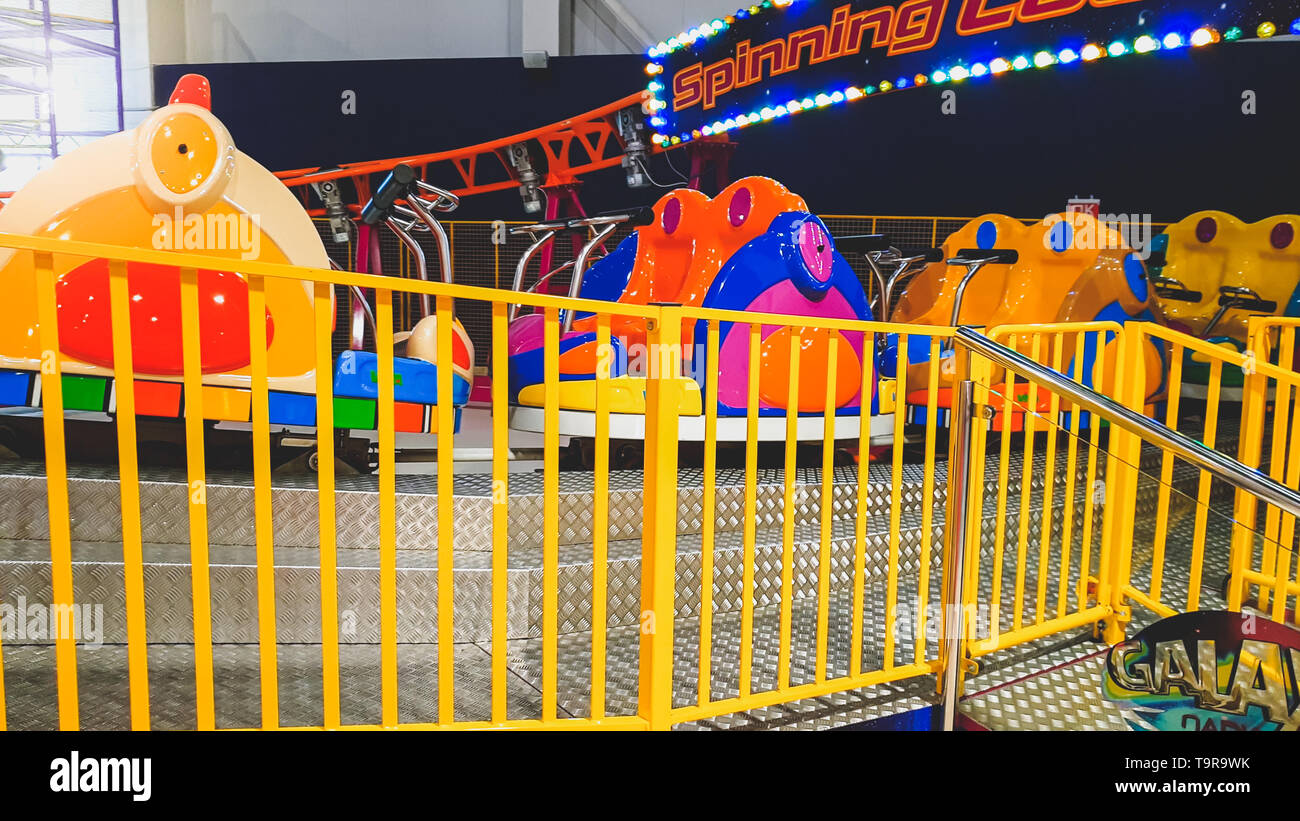 Photo of colorful train carousel for little children in amusement park ...