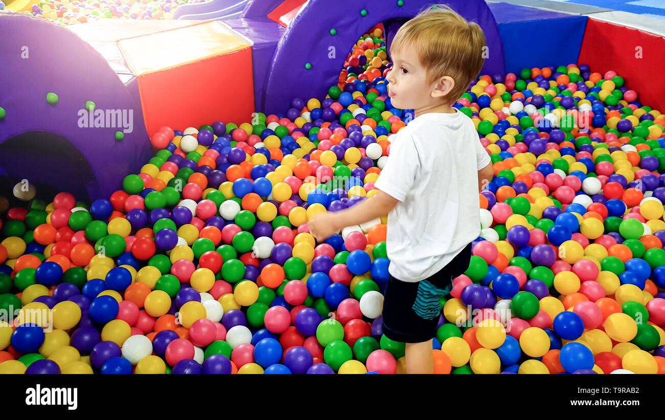 Image of 3 years old toddler boy playing and having fun on the ...