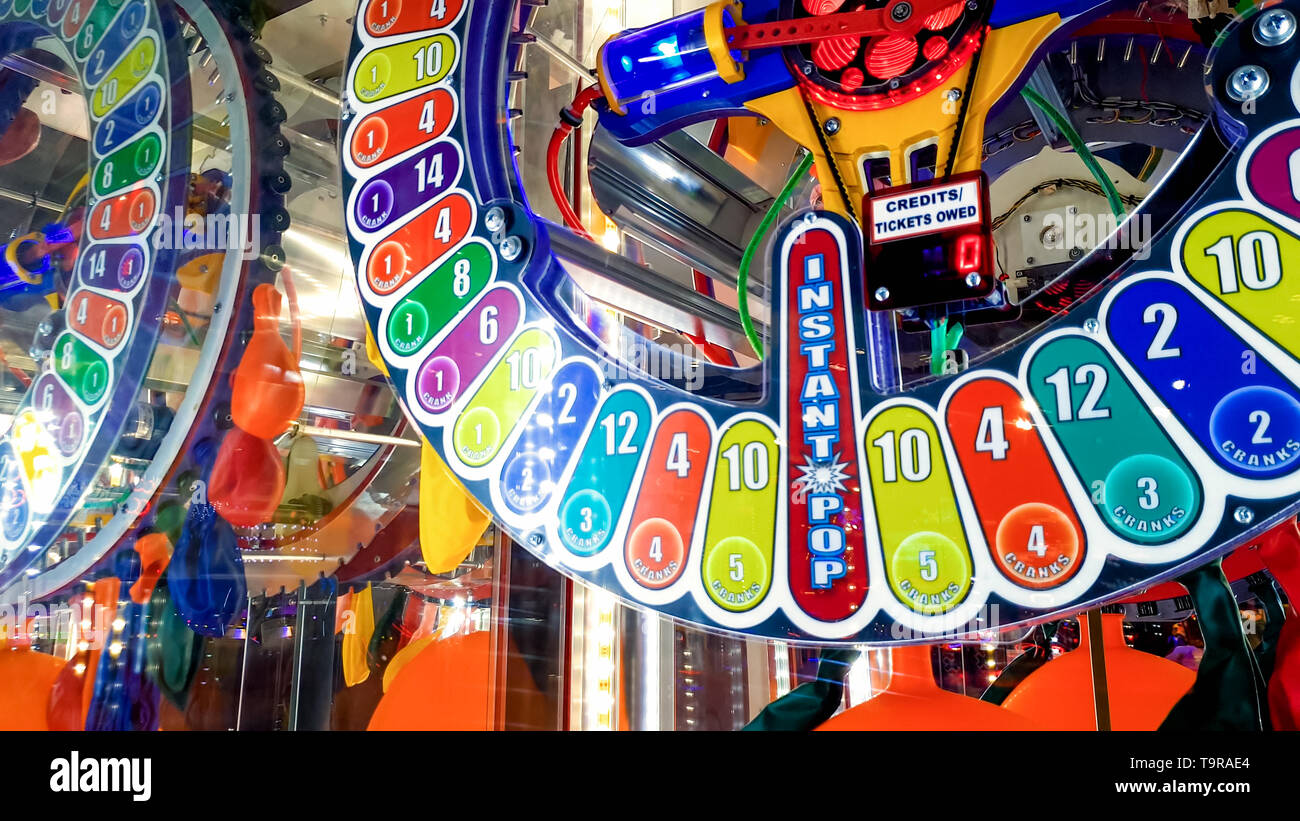 Closeup image of colroful illuminated round display in casino or ...