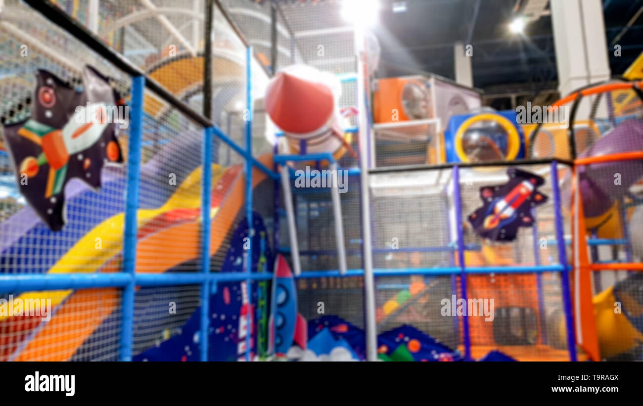 Out of focus image of colorful big children playground with lots of ...