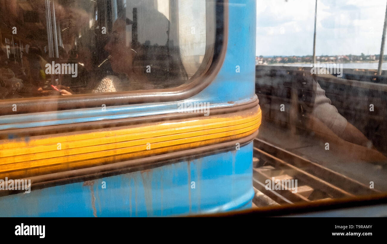 Closeup toned image of sad tired people riding in dirty rusty subway ...