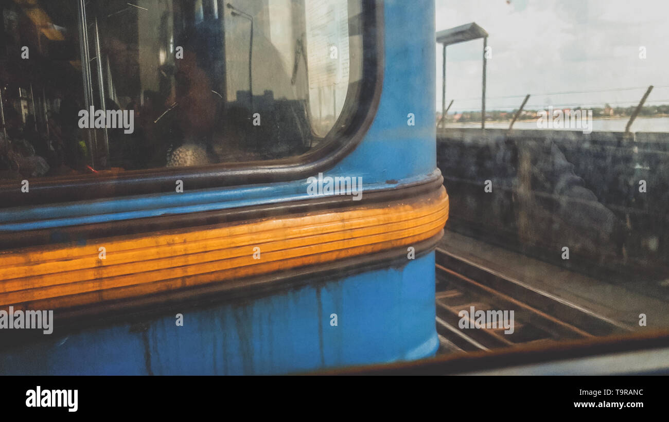 Closeup toned image of sad tired people riding in dirty rusty subway ...