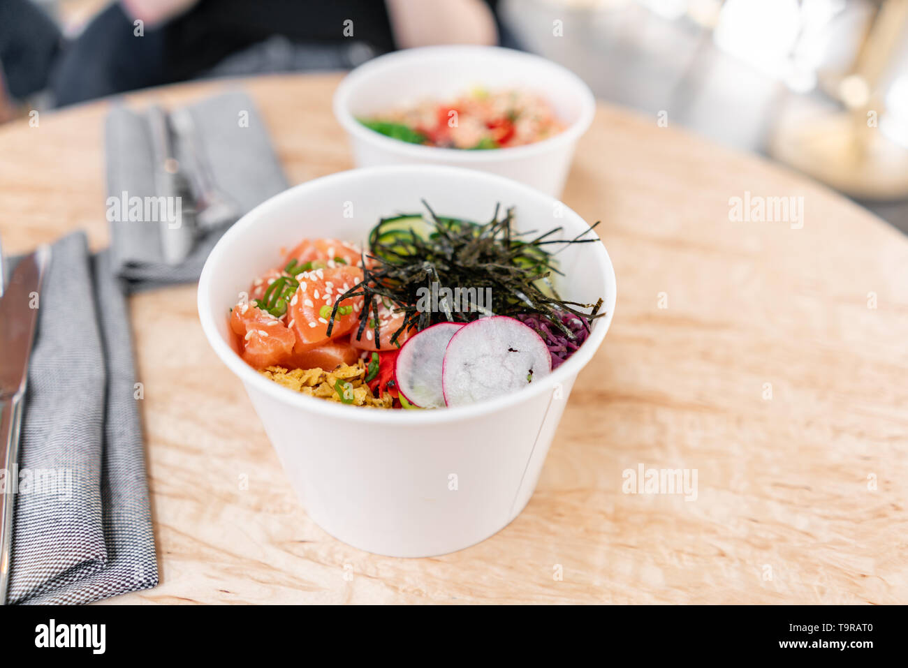 Traditional Hawaiian dish poke bowl with fork. Hawaiian salmon fish ...