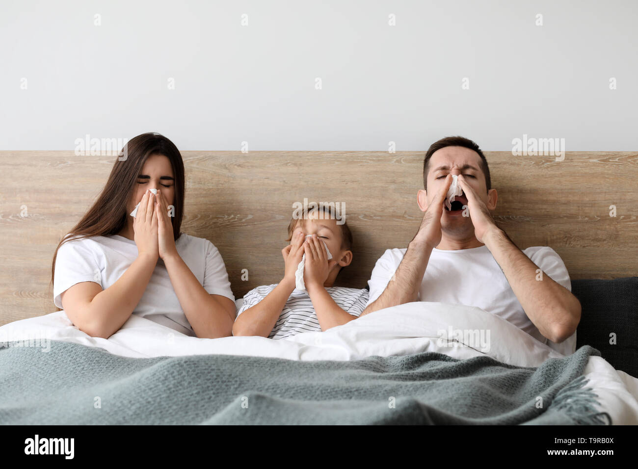Family ill with flu at home Stock Photo - Alamy