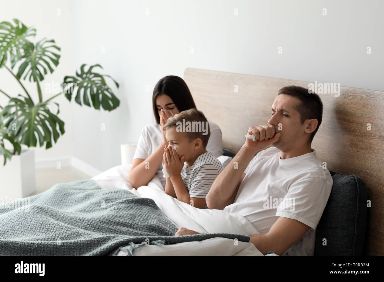 Family ill with flu at home Stock Photo - Alamy