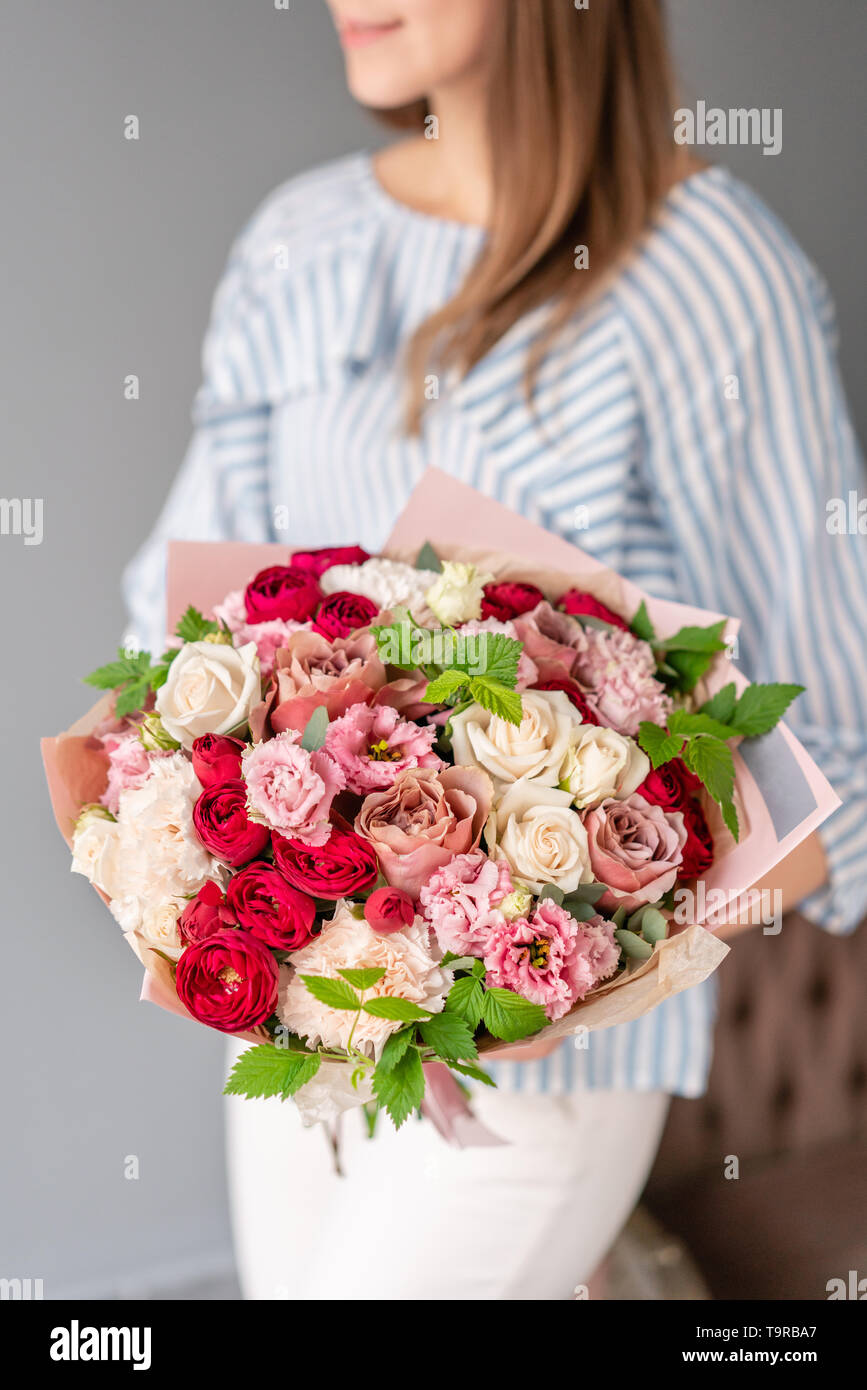 Beautiful bouquet of mixed flowers in woman hand. Floral shop concept ...