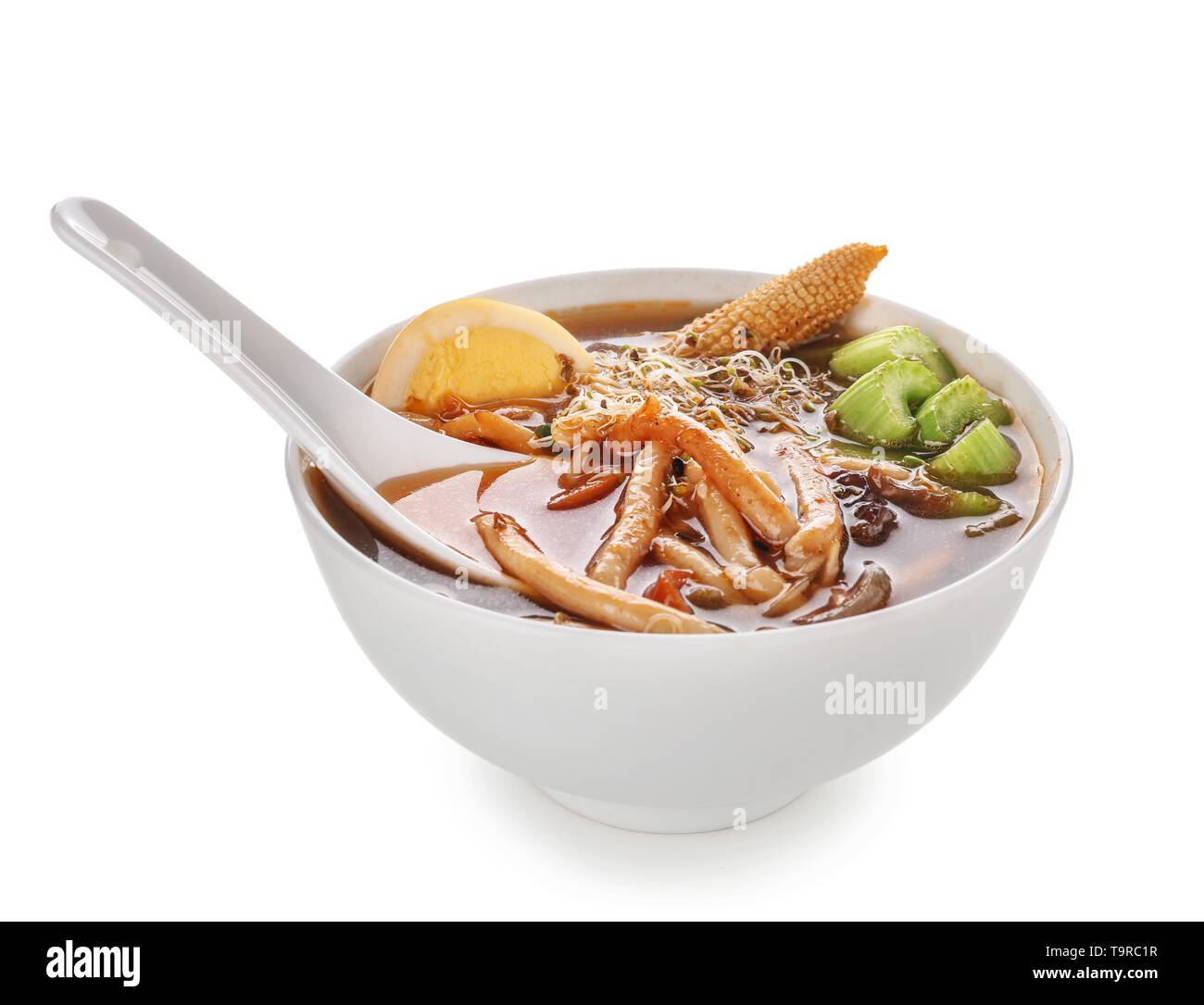 Tasty Chinese soup in bowl on white background Stock Photo - Alamy
