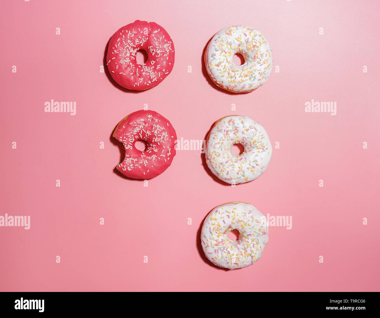Tasty sweet donuts on color background Stock Photo - Alamy
