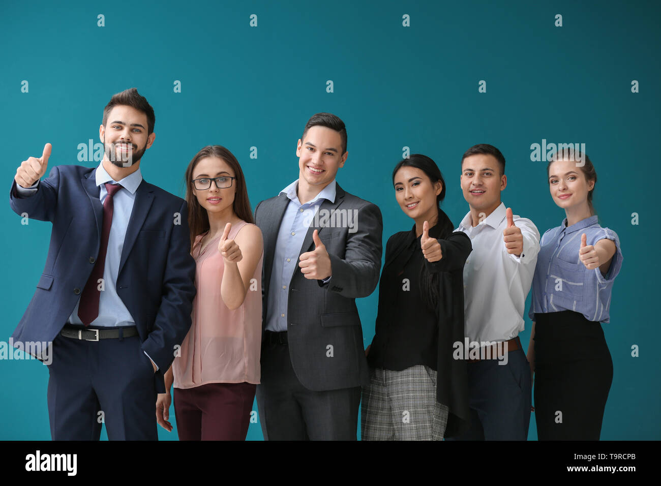 Team of young people on color background Stock Photo - Alamy