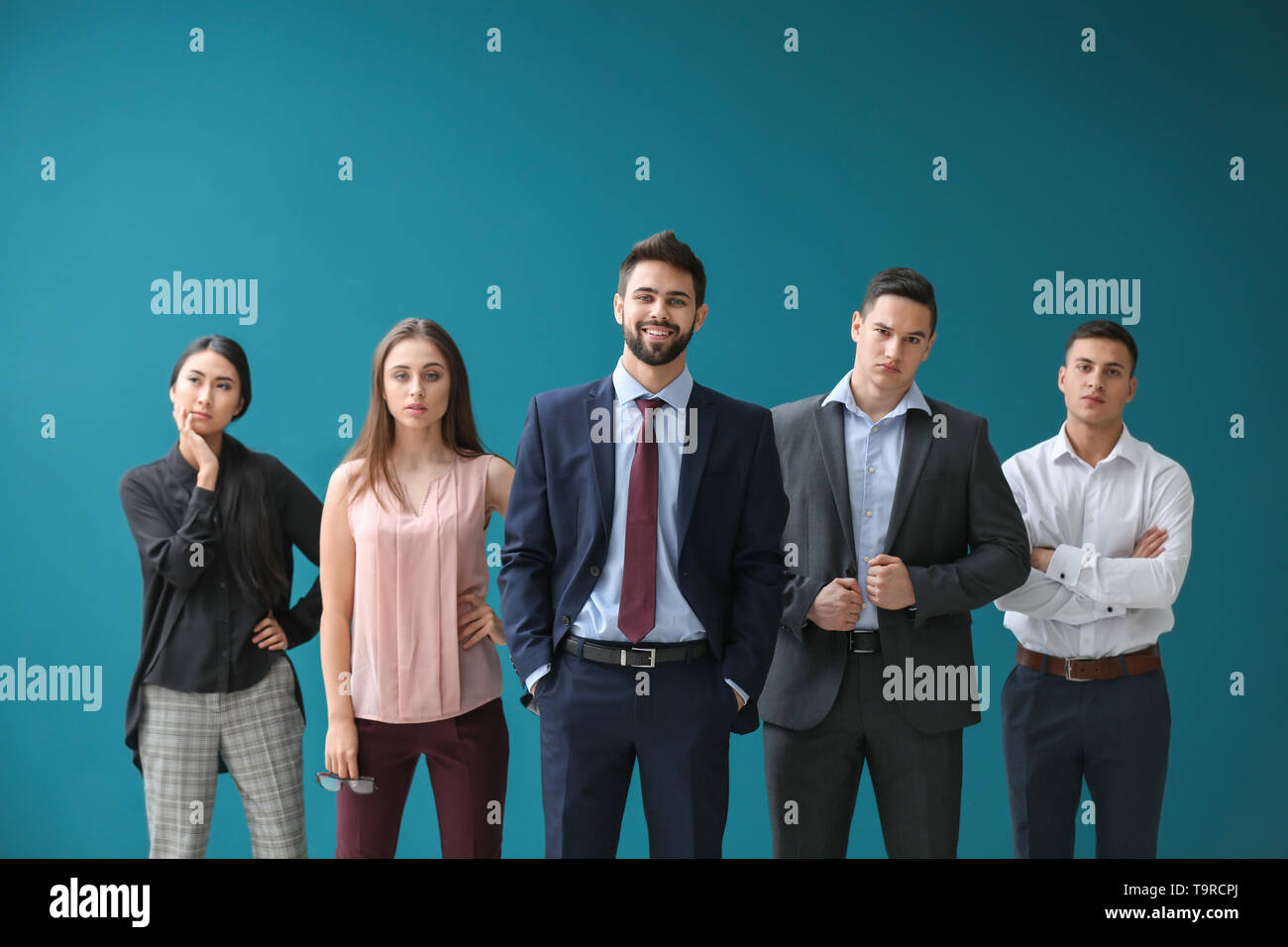 Team of young people on color background Stock Photo - Alamy