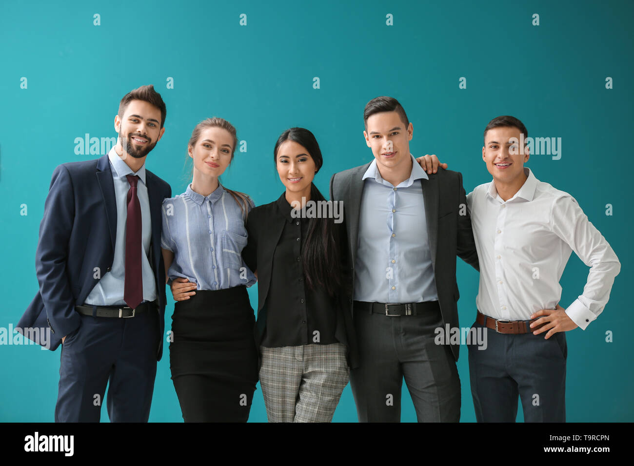 Team of young people on color background Stock Photo - Alamy