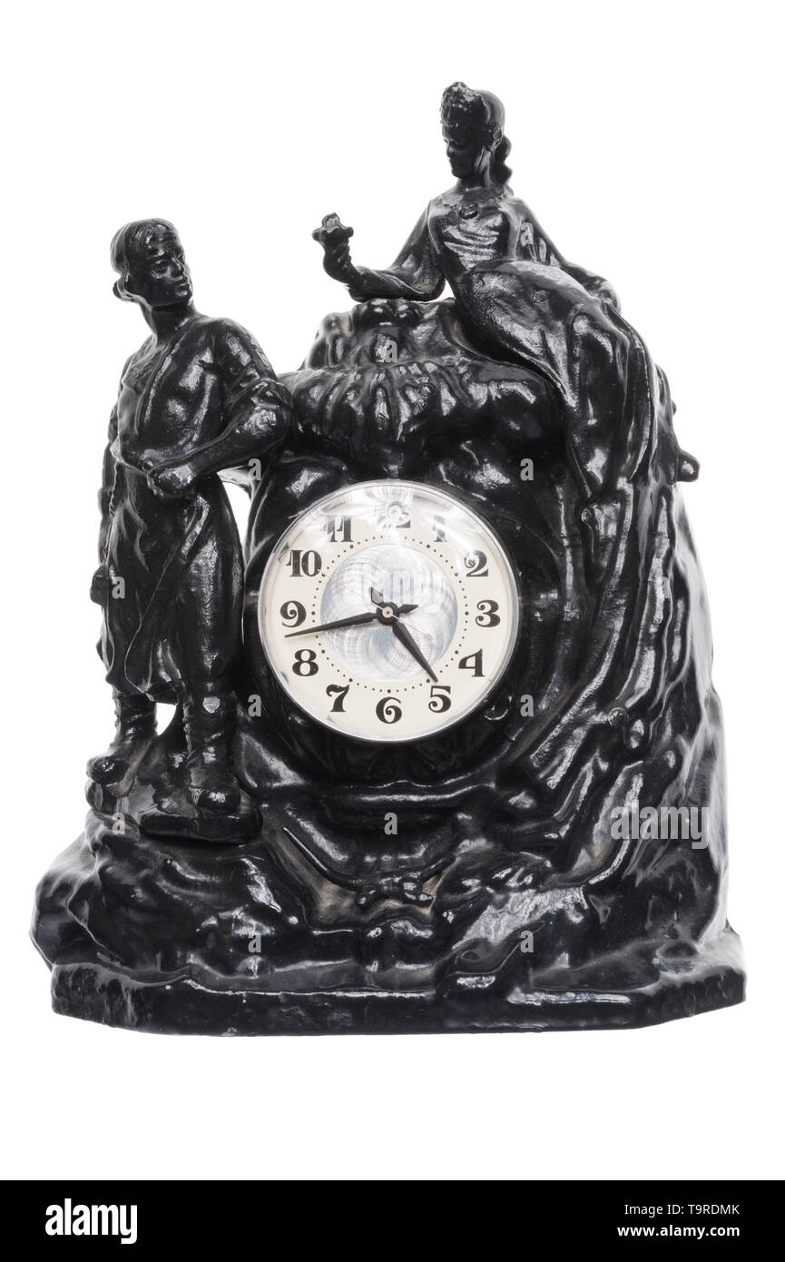 table clock in sculpture isolated on white background Stock Photo - Alamy