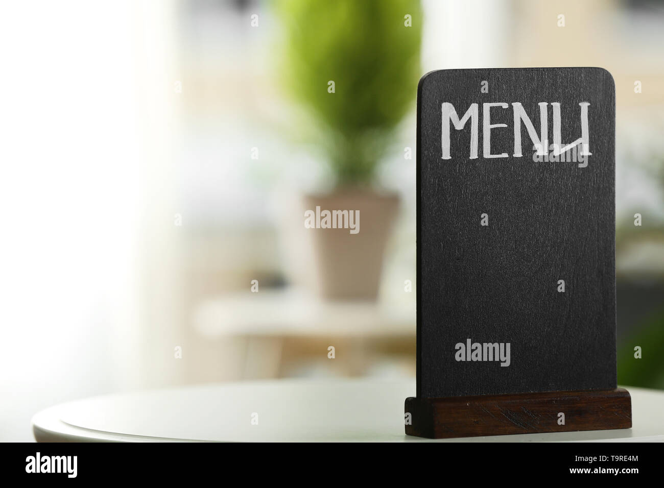 Menu board on table in cafe Stock Photo - Alamy