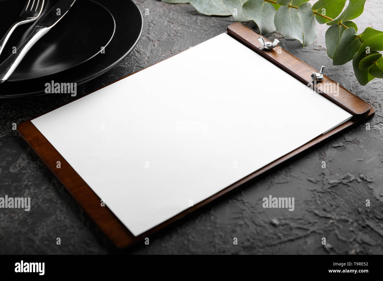 Blank menu on grey table in restaurant Stock Photo - Alamy