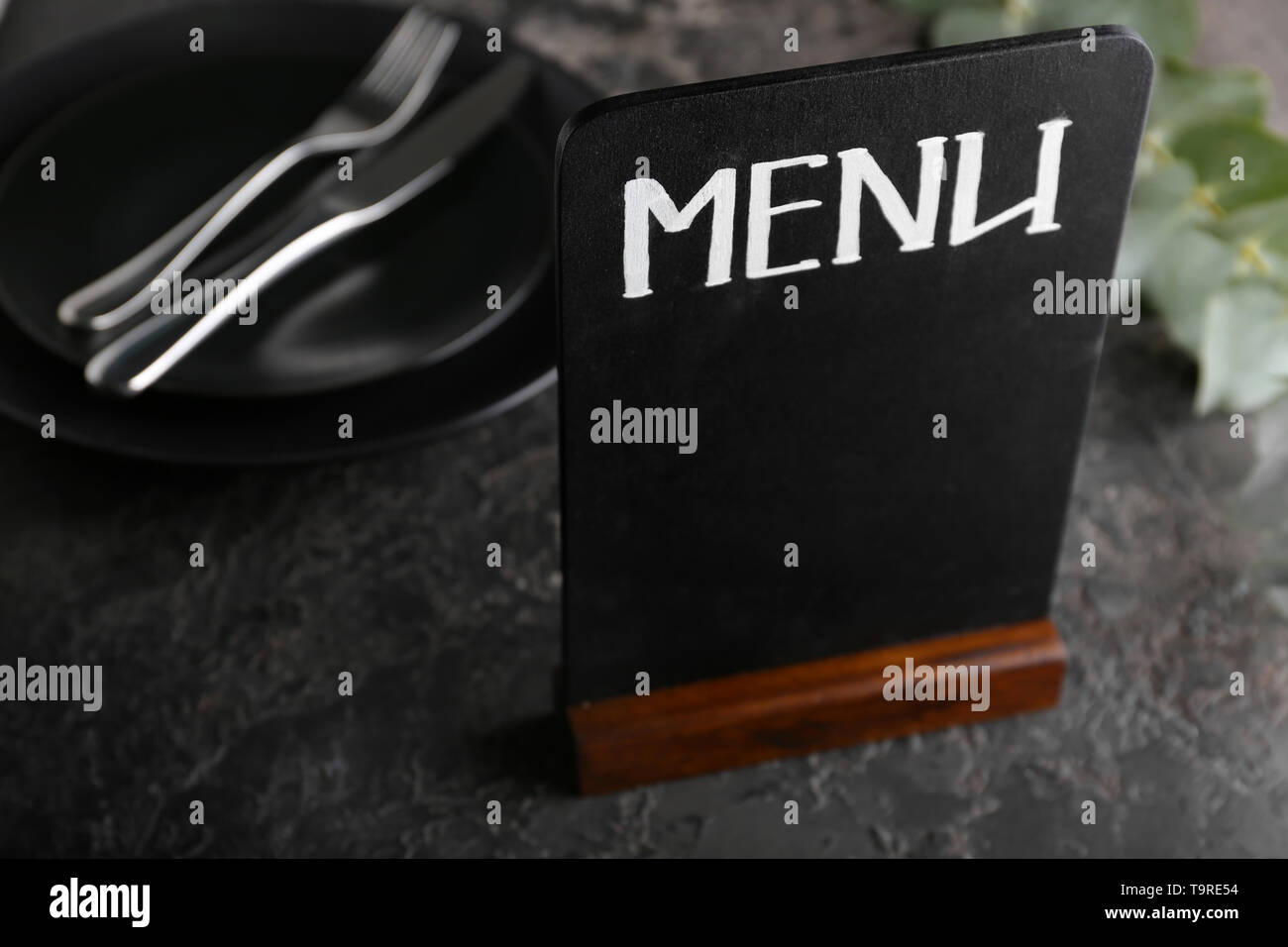 Menu board on grey table Stock Photo - Alamy