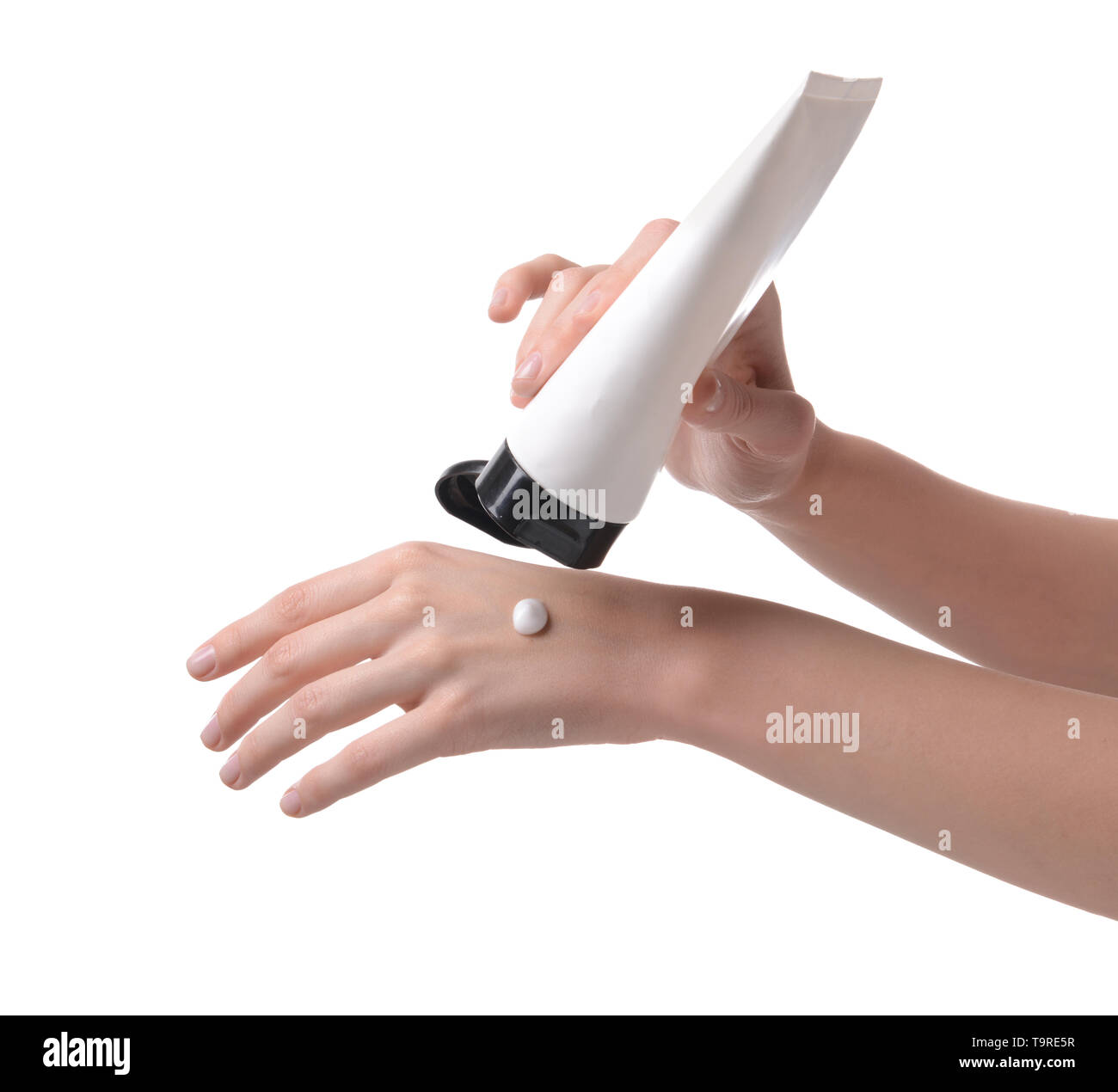 Woman applying hand cream on white background Stock Photo - Alamy