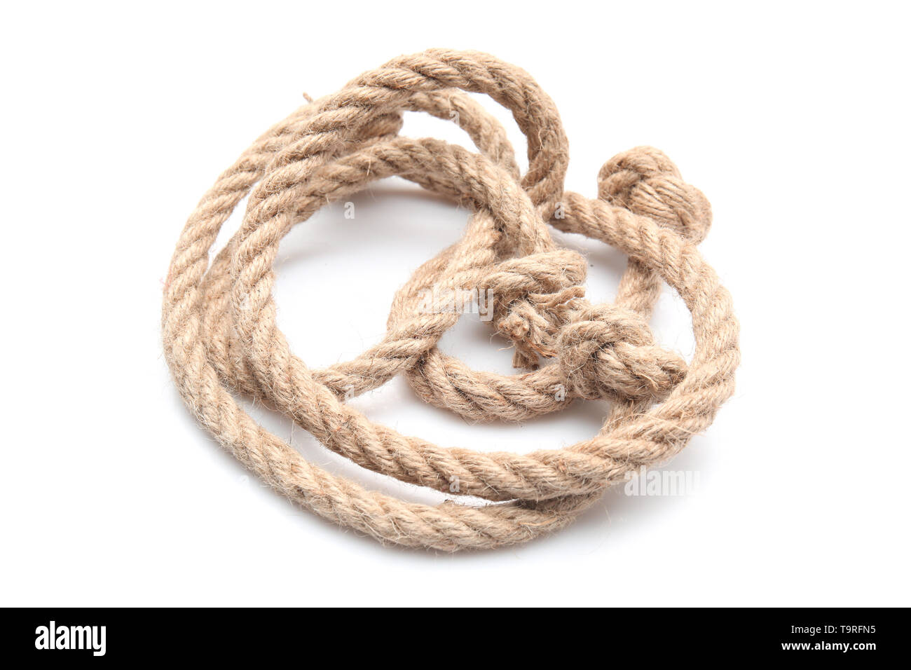 Rolled rope on white background Stock Photo - Alamy