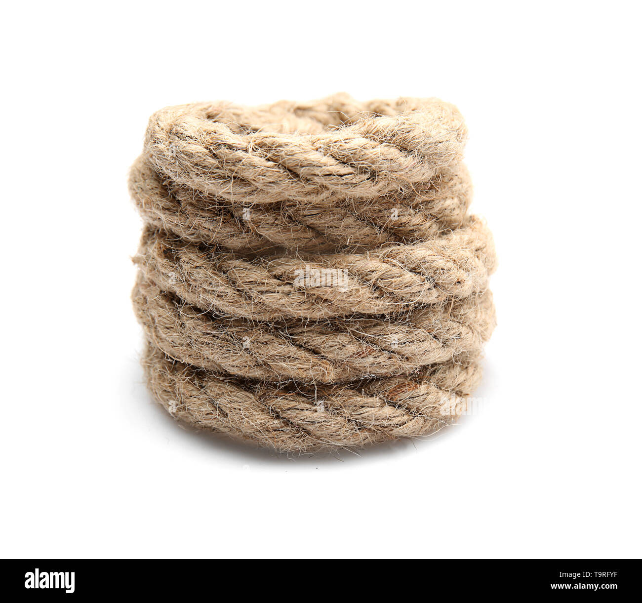 Rolled rope on white background Stock Photo - Alamy