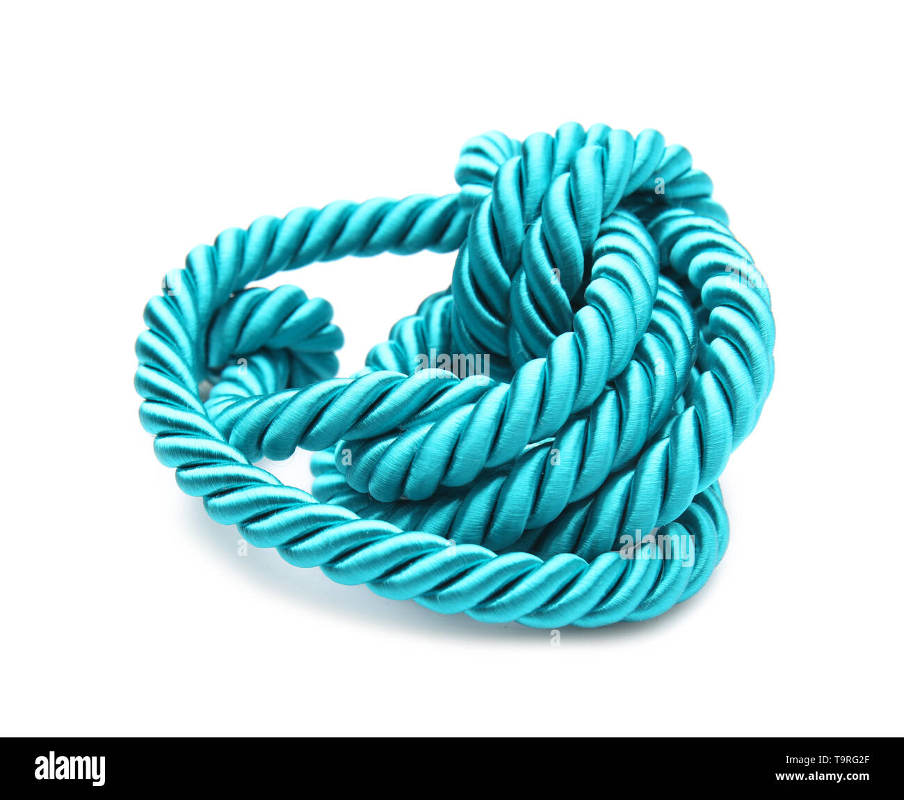 Rolled rope on white background Stock Photo - Alamy
