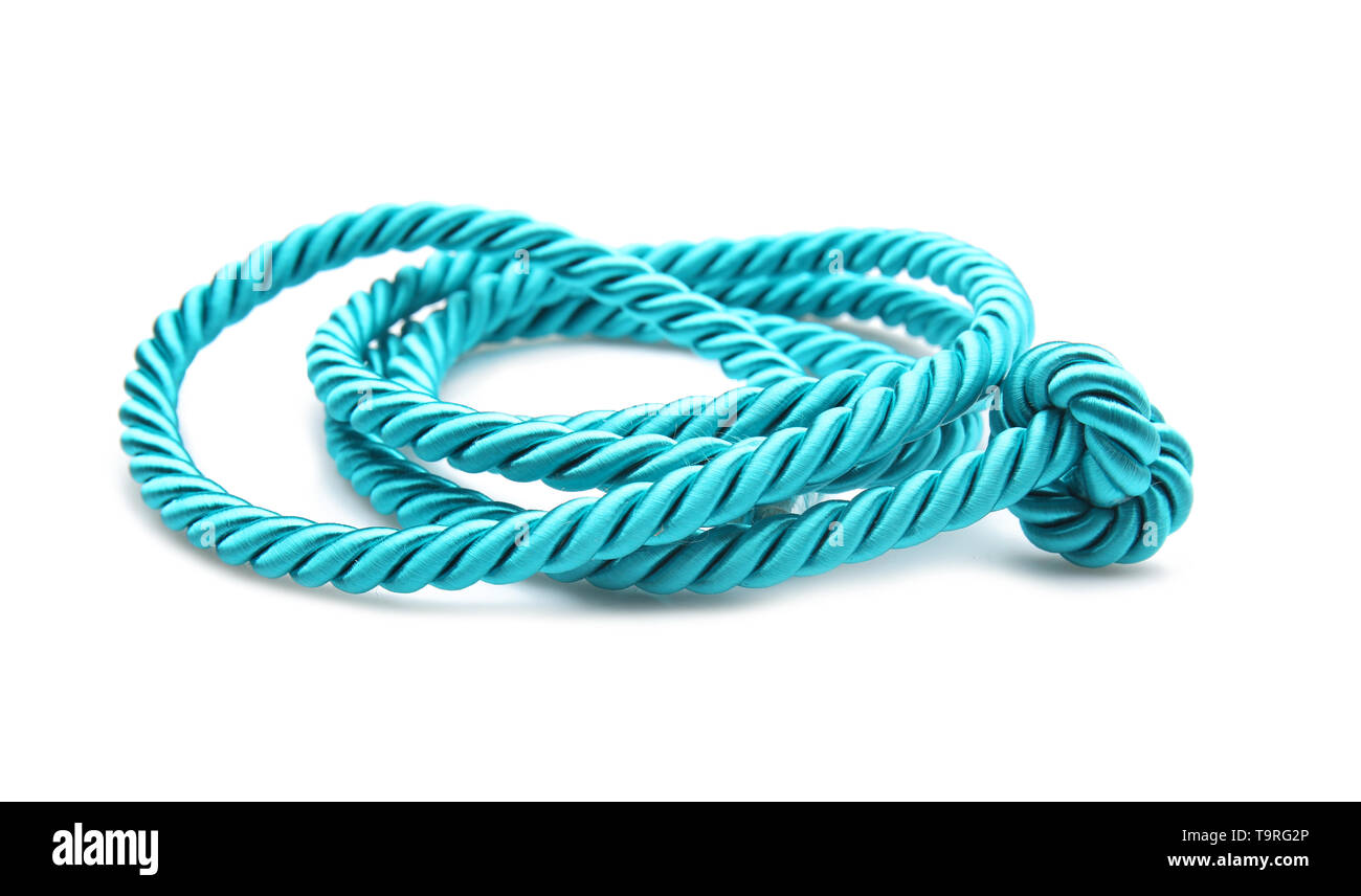 Rolled rope on white background Stock Photo - Alamy