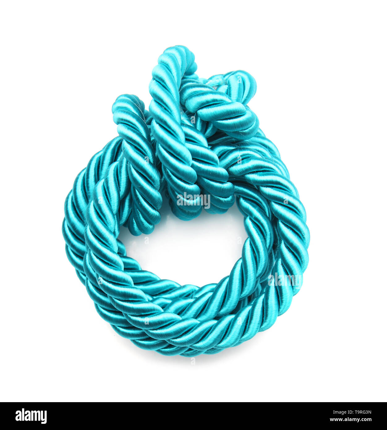 Rolled rope on white background Stock Photo - Alamy