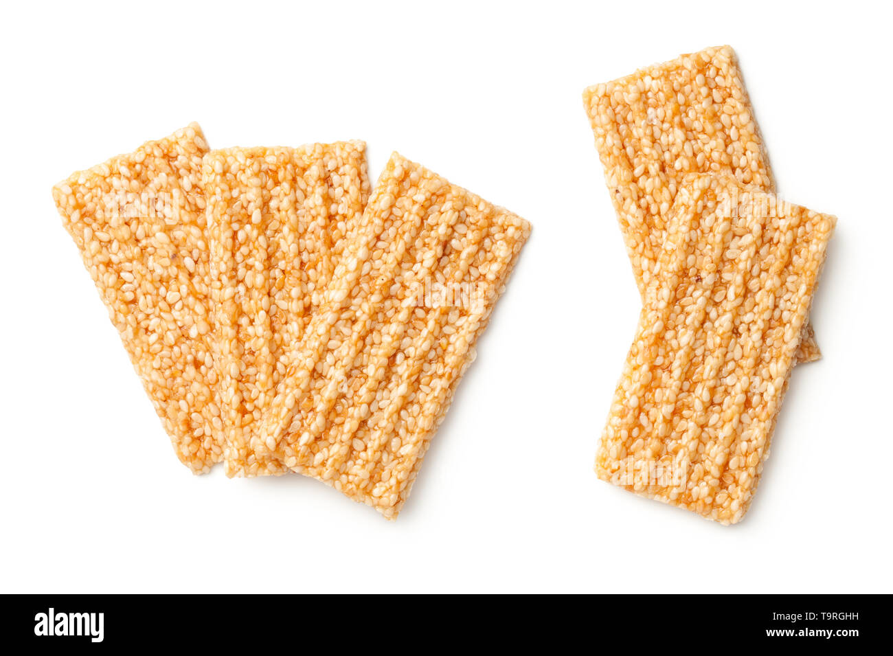 Sesame seed bars isolated on white background. Top view Stock Photo - Alamy