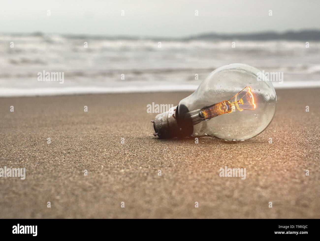 Filament Bulb on the beach Stock Photo - Alamy