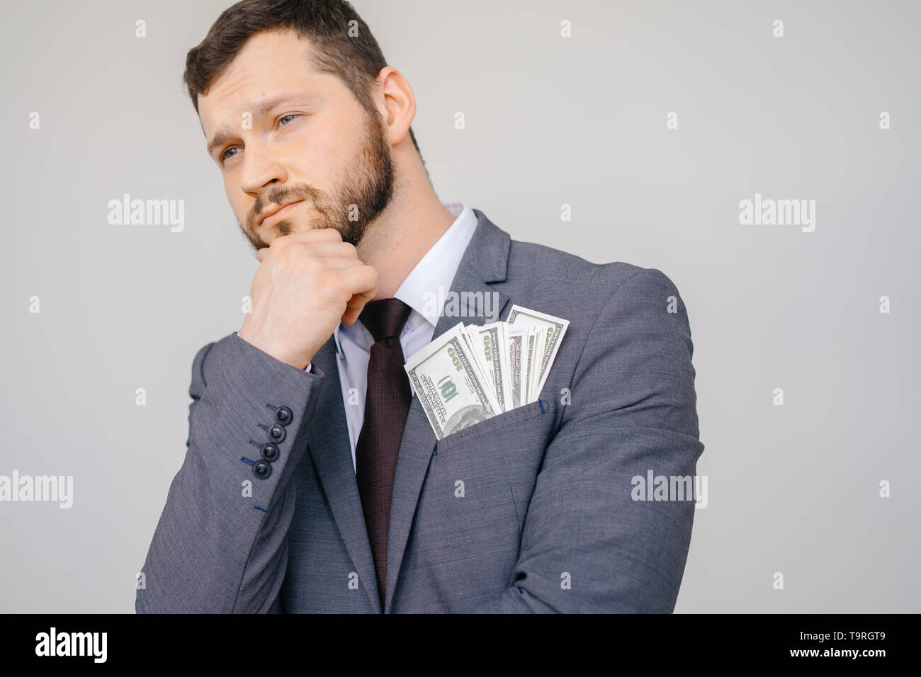 Thoughtful corporate guy Stock Photo - Alamy