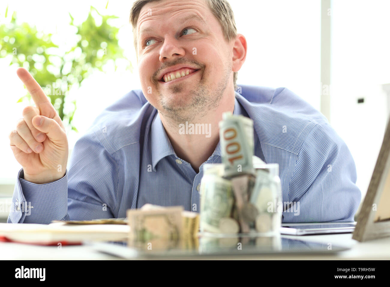 Money thinking hi-res stock photography and images - Alamy