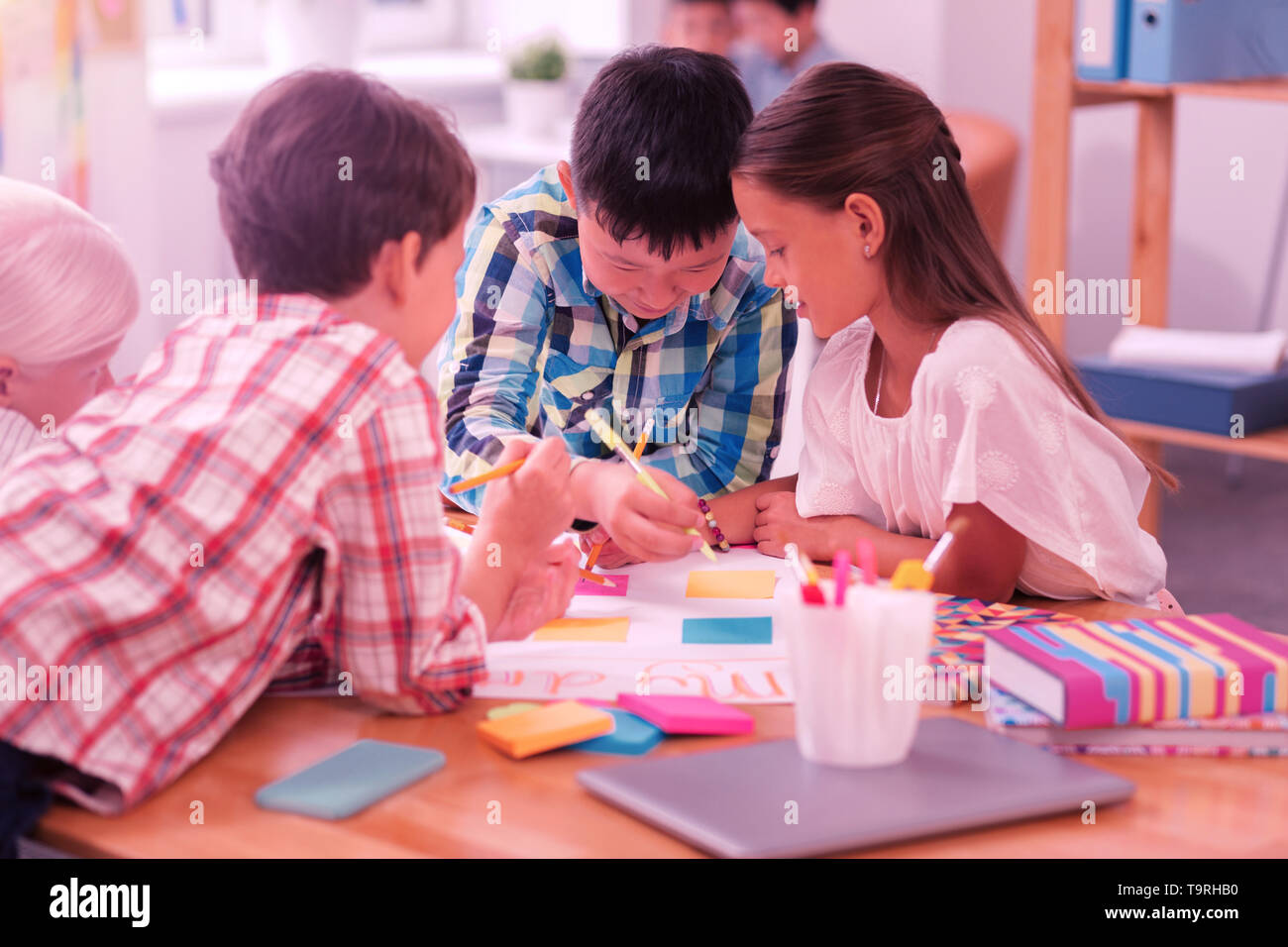 Pupils making their school project in group Stock Photo - Alamy